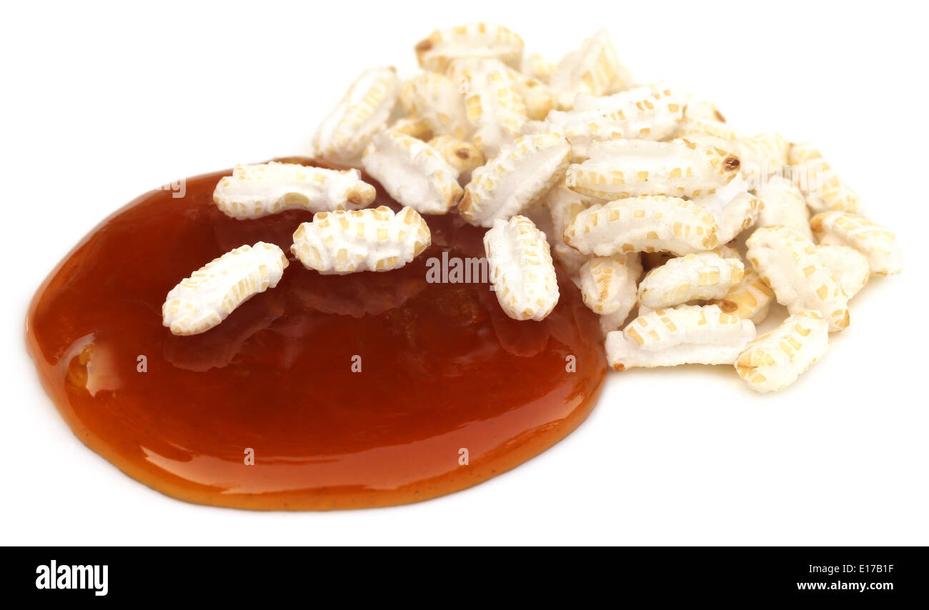 Popped rice with molasses over white background Stock Photo - Alamy