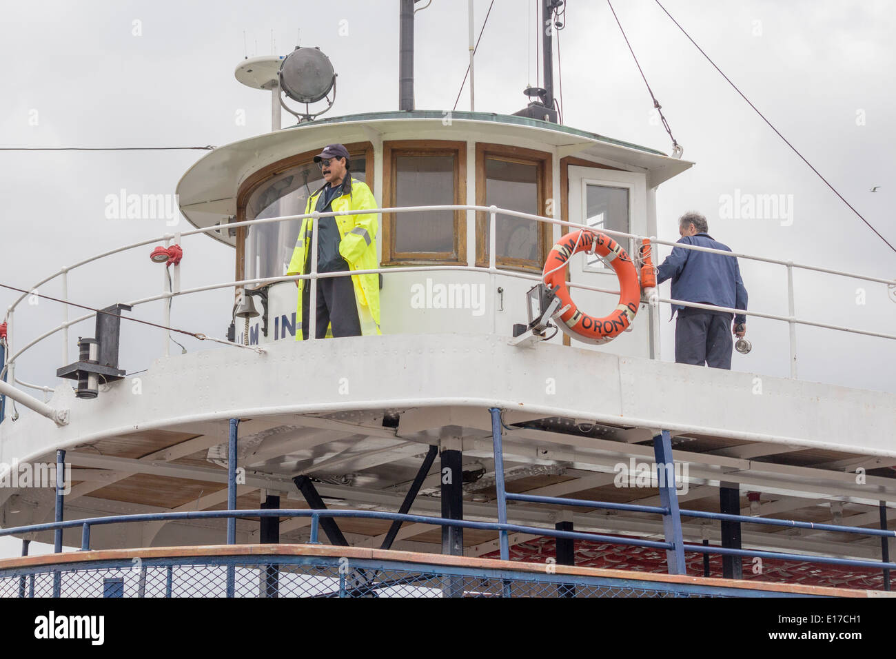 Captain of Toronto Ferry supervising the docking of his ferry at Ward's ...