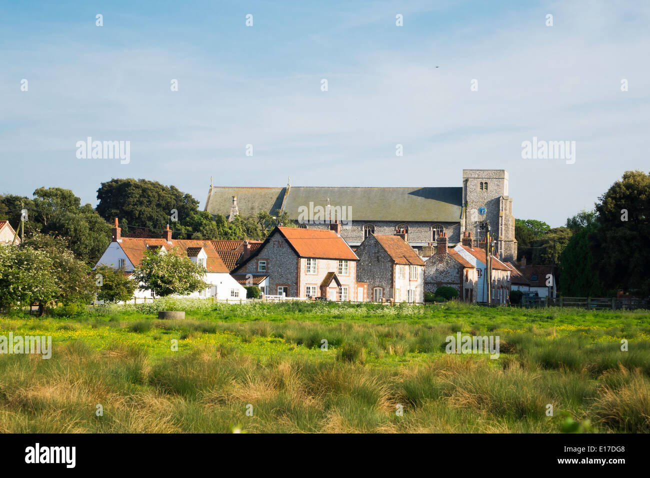 The village of Thornham in North Norfolk UK with All Saints Church seen ...