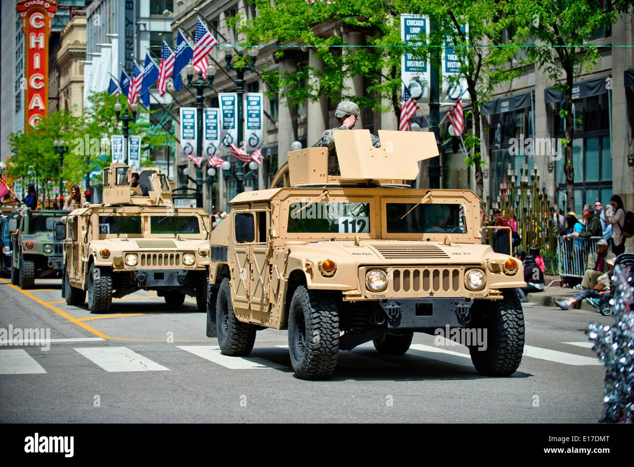 A US Army armored Humvee rides past the Chicago Theatre during a ...