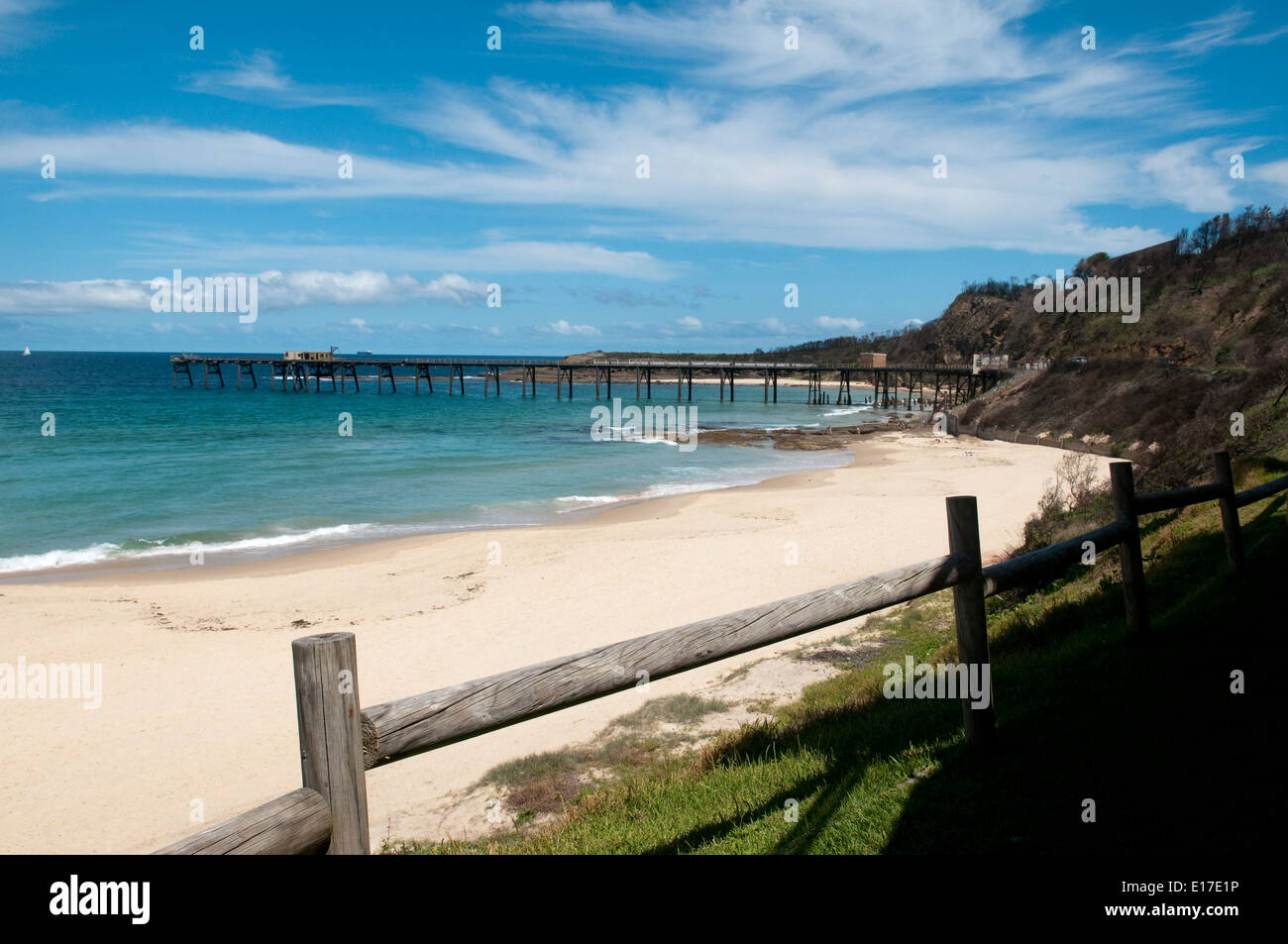 The old coal pier provides the backdrop to the Blue skies and the white ...
