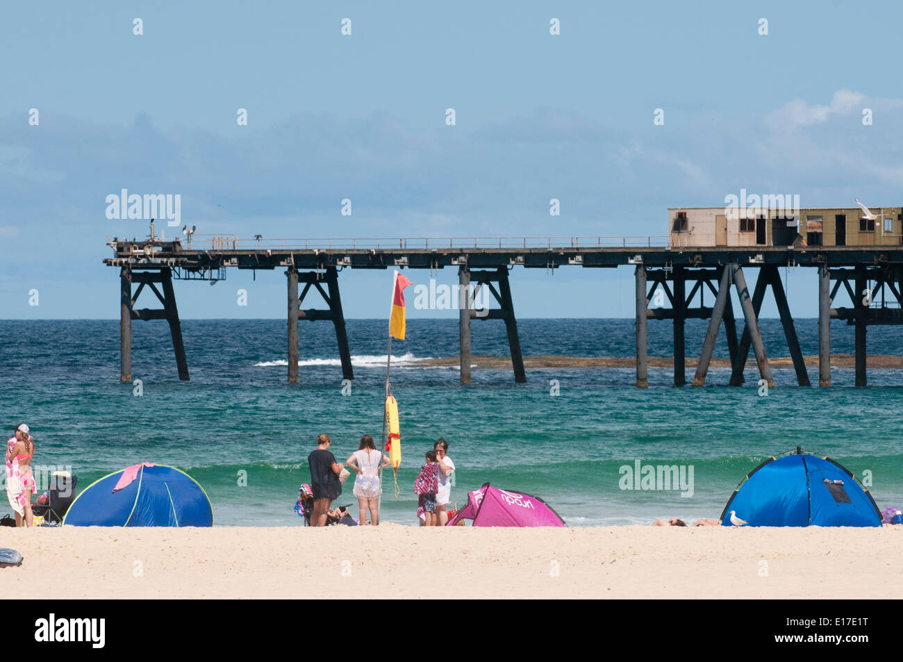 The old coal pier provides the backdrop to the Blue skies and the white ...