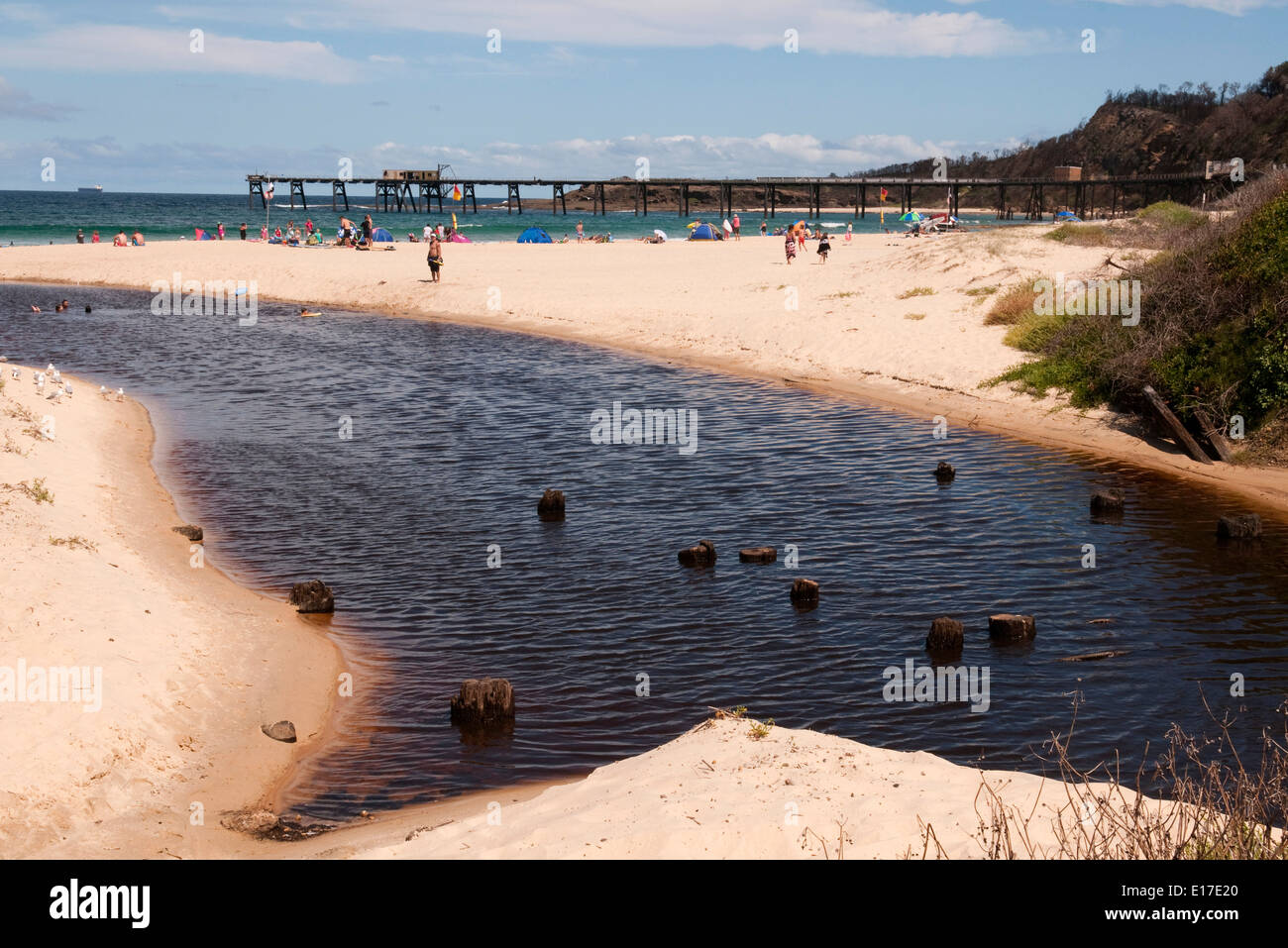 The old coal pier provides the backdrop to the Blue skies and the white ...