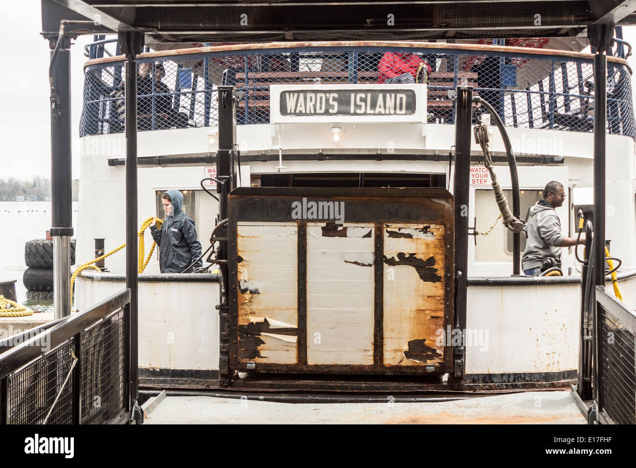 Ferry arriving from Ward's Island to Toronto Ferry Docks with two dock ...