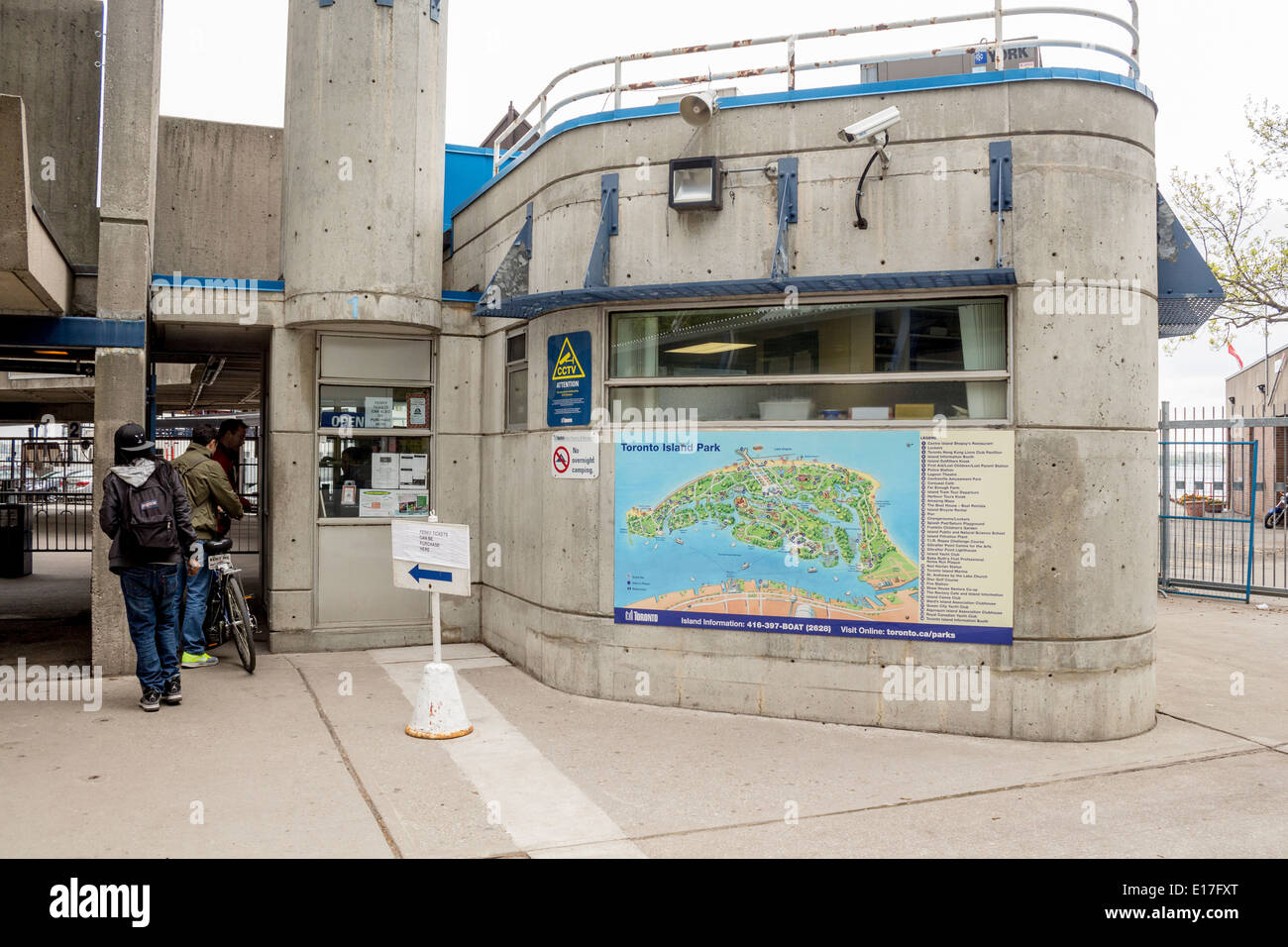 People going through the ferry terminal at Jack Layton Ferry Docks in ...