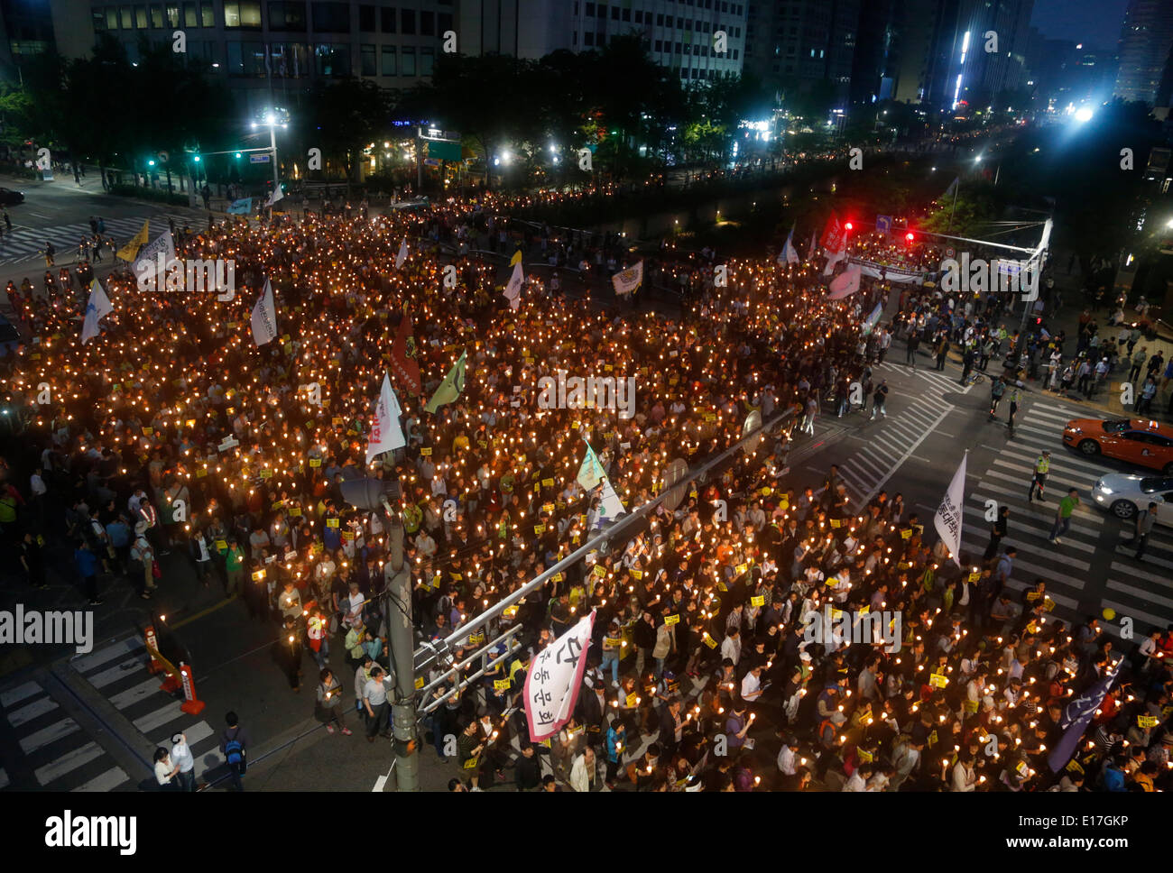 Seoul, South Korea. 24th May, 2014. Participants march during a candle ...