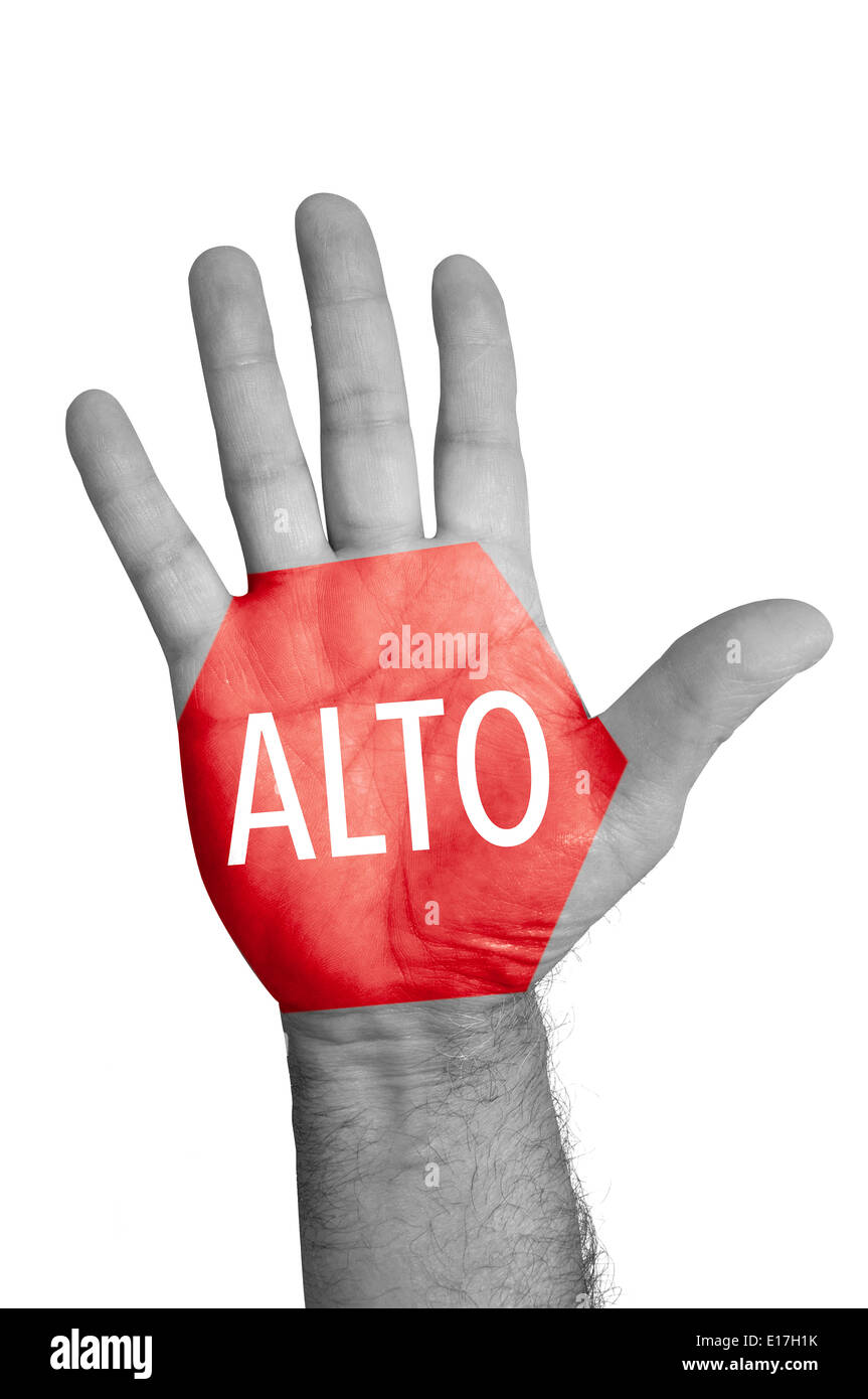 Stopping hand with red sign in Spanish Stock Photo - Alamy
