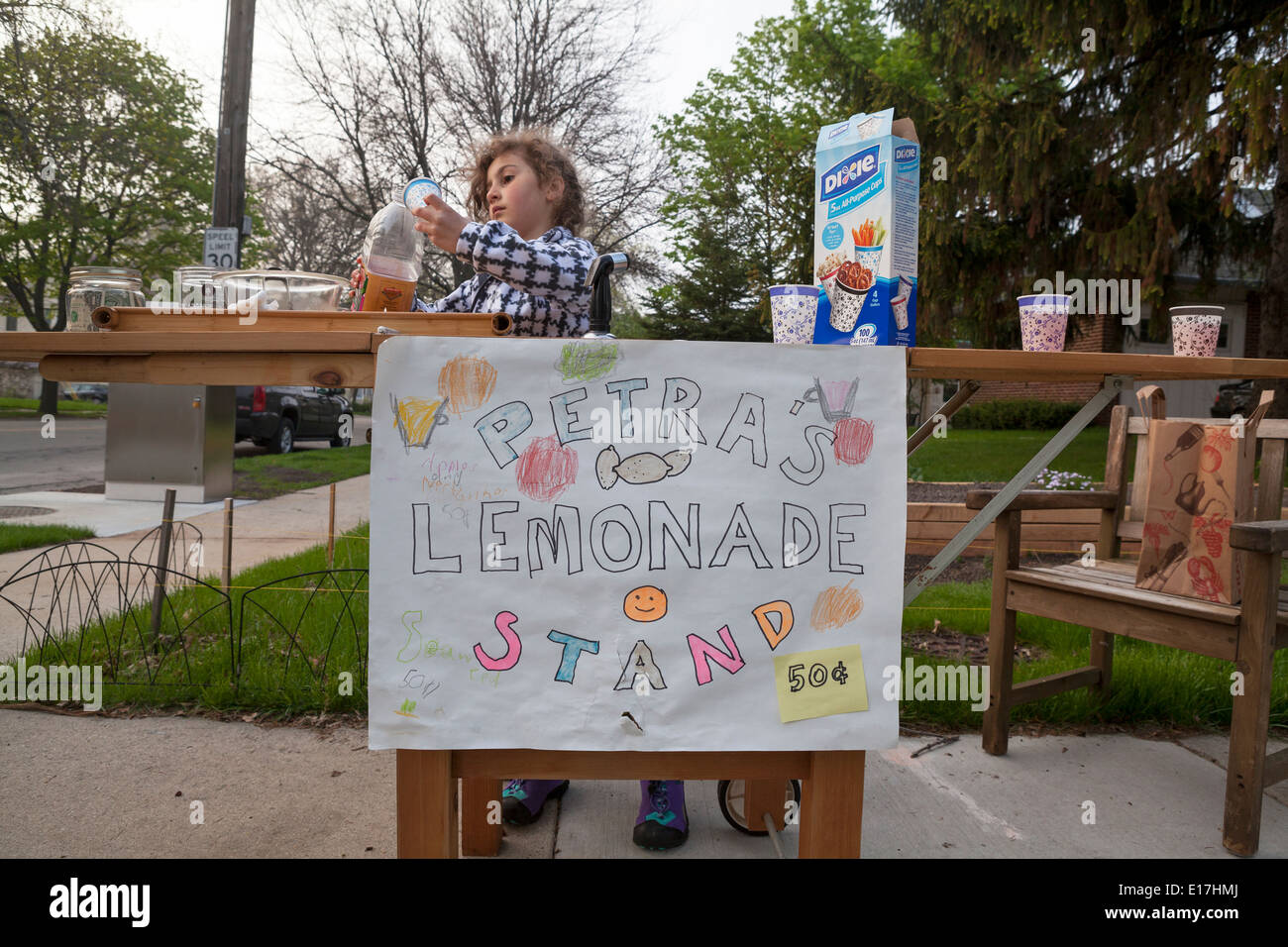 A neighborhood girl sells lemonade at her stand in Milwaukee, Wisconsin ...