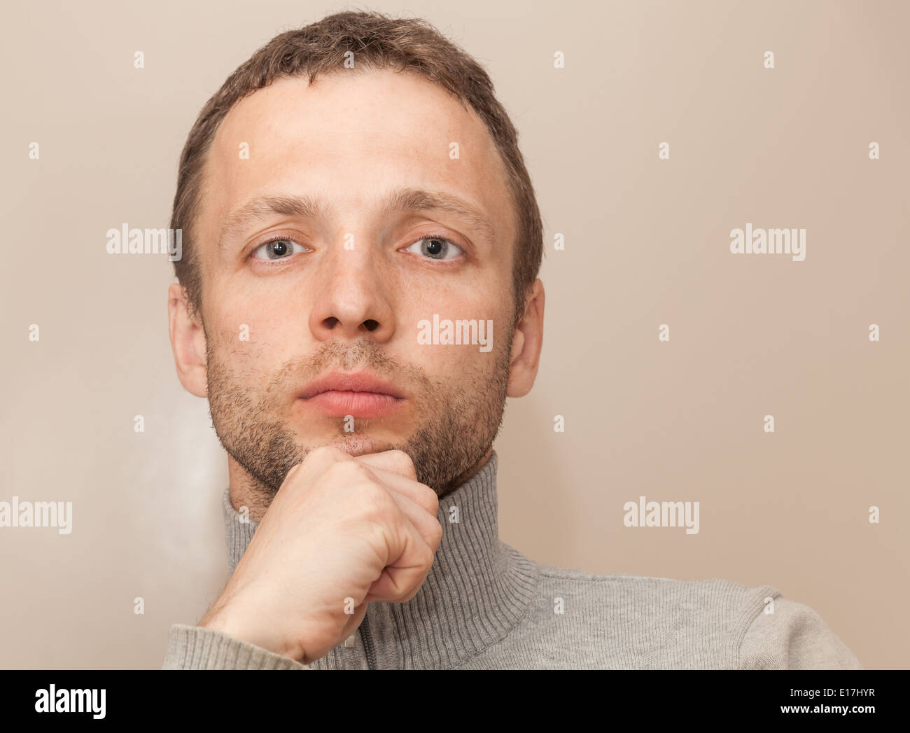 Thinking young man hi-res stock photography and images - Alamy