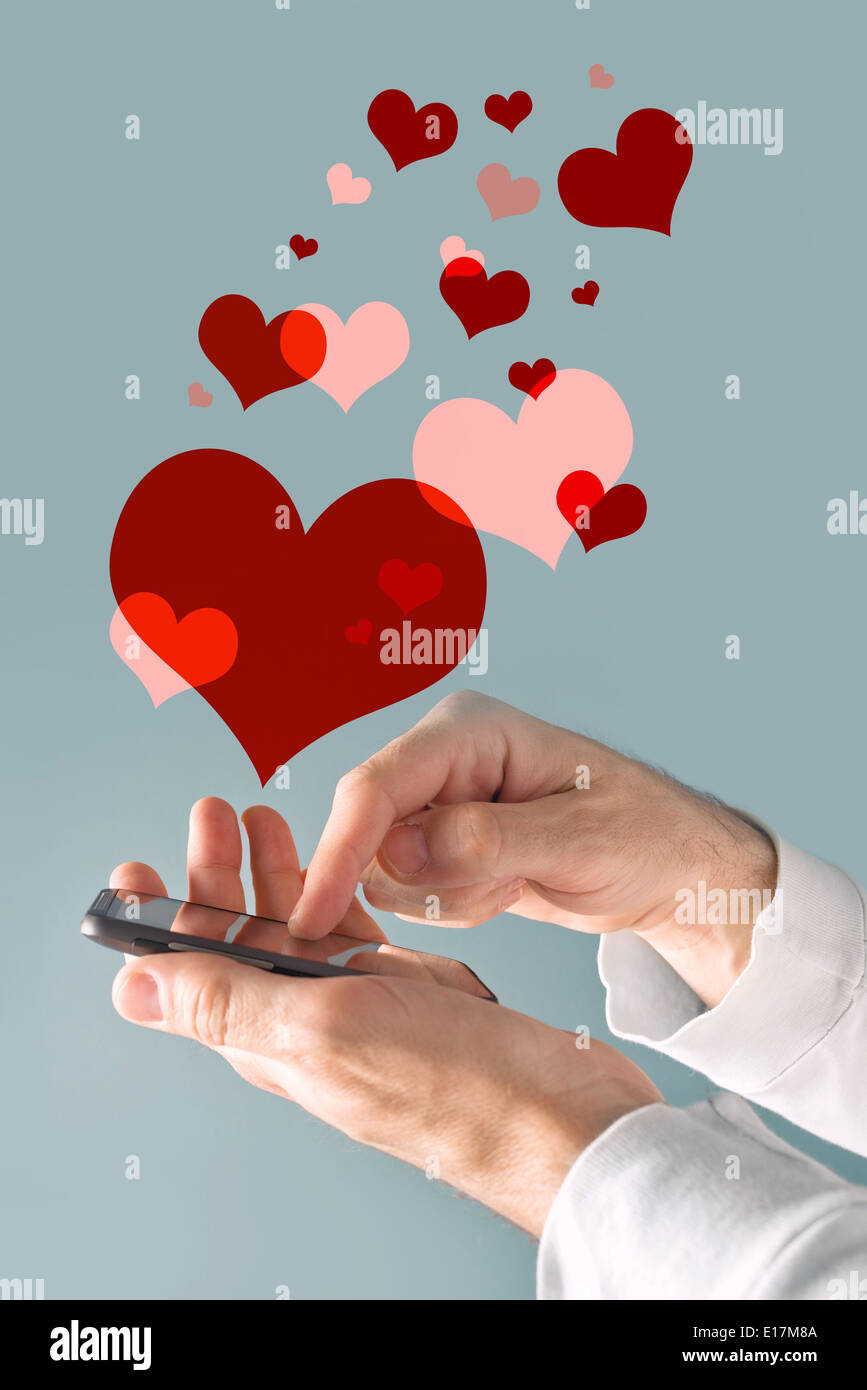 Touch screen mobile smart phone in male hands sending romantic messages ...