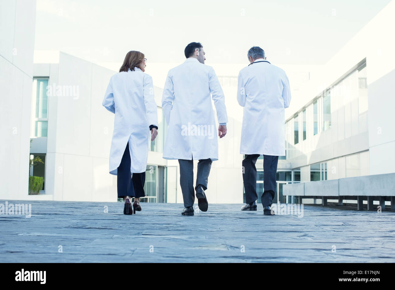 Asian male doctor walking hi-res stock photography and images - Alamy