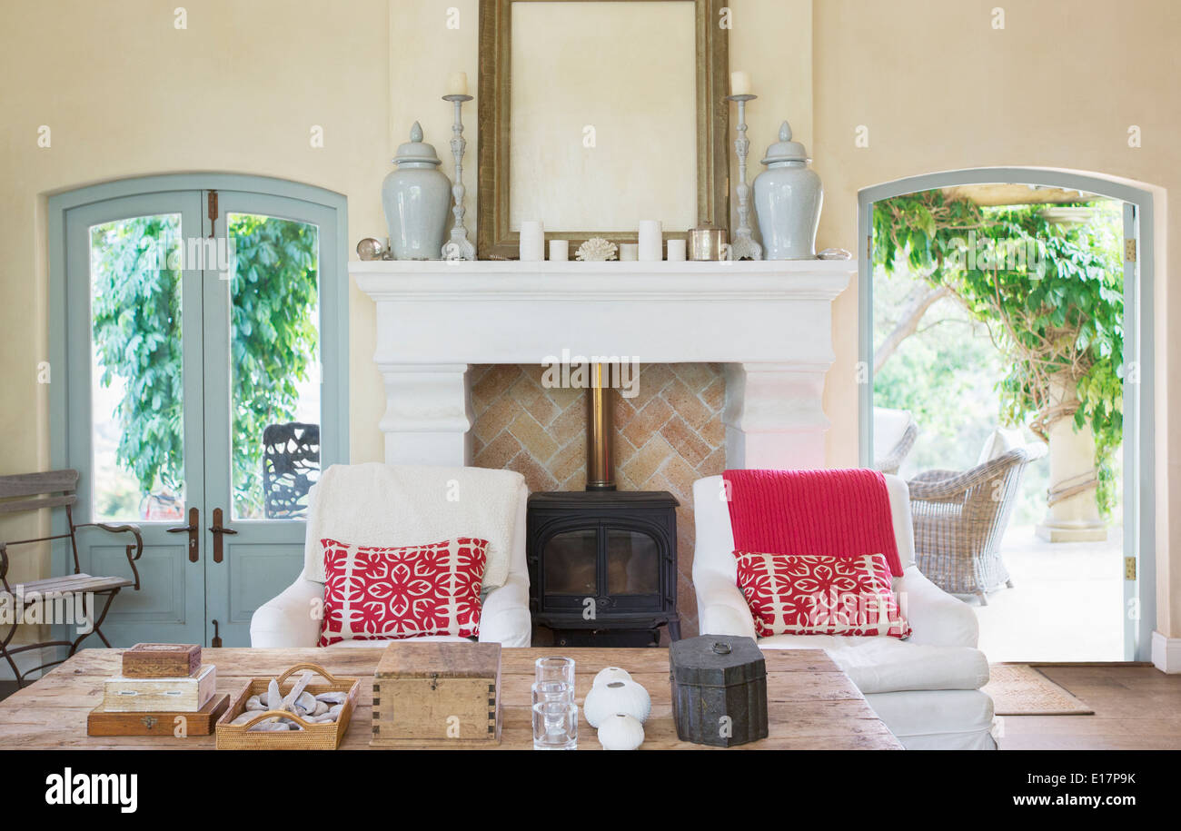 Luxury living room with wood stove Stock Photo - Alamy