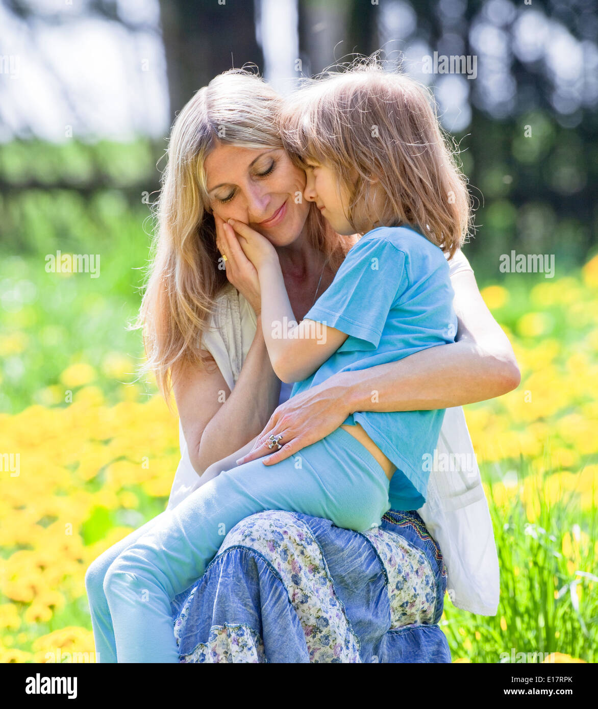 Child sitting on mom lap hi-res stock photography and images - Alamy
