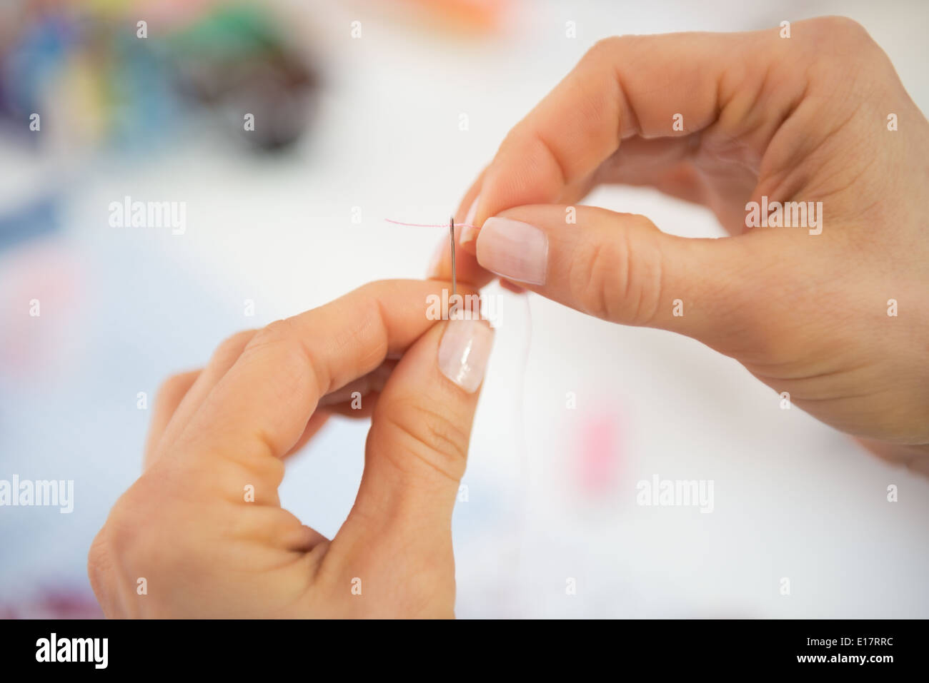 Woman needle threading studio hi-res stock photography and images - Alamy