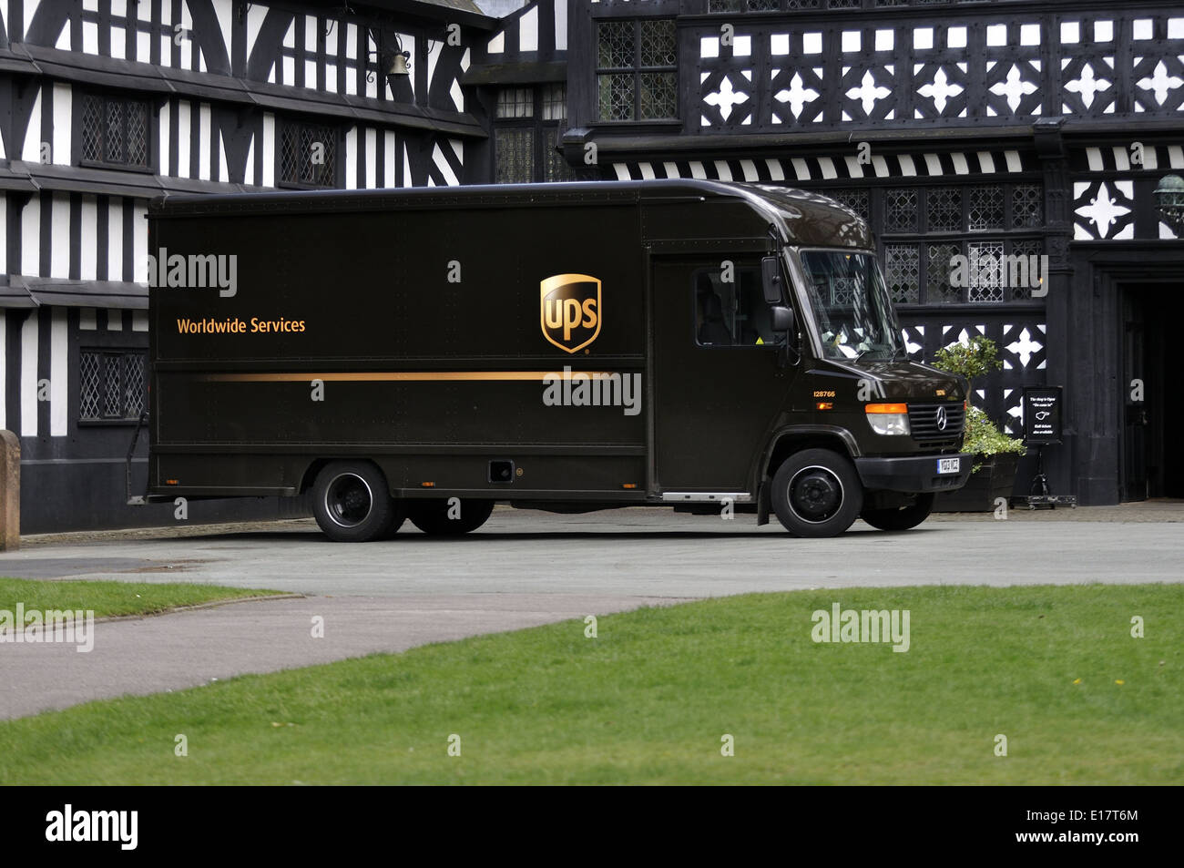 UPS van parked by tudor style building Stock Photo - Alamy