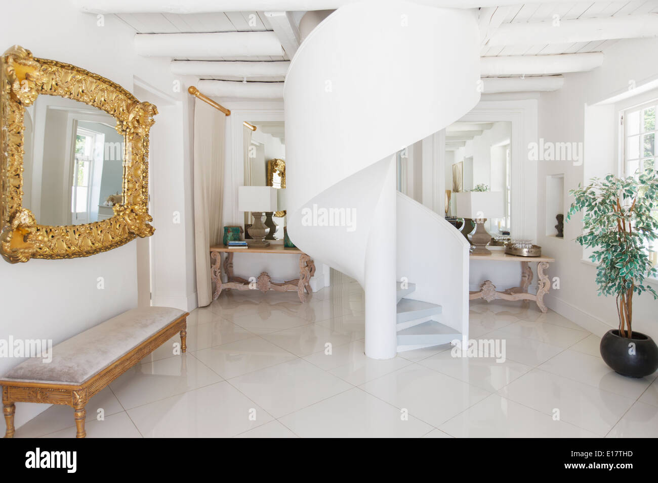 Spiral staircase in luxury foyer Stock Photo - Alamy