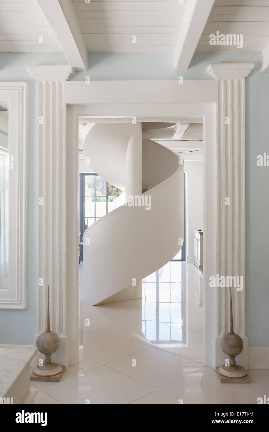 Spiral staircase in luxury foyer Stock Photo - Alamy