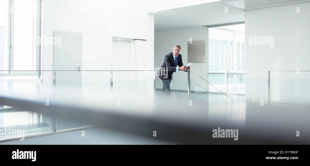 Man leaning on balcony railing hi-res stock photography and images - Alamy