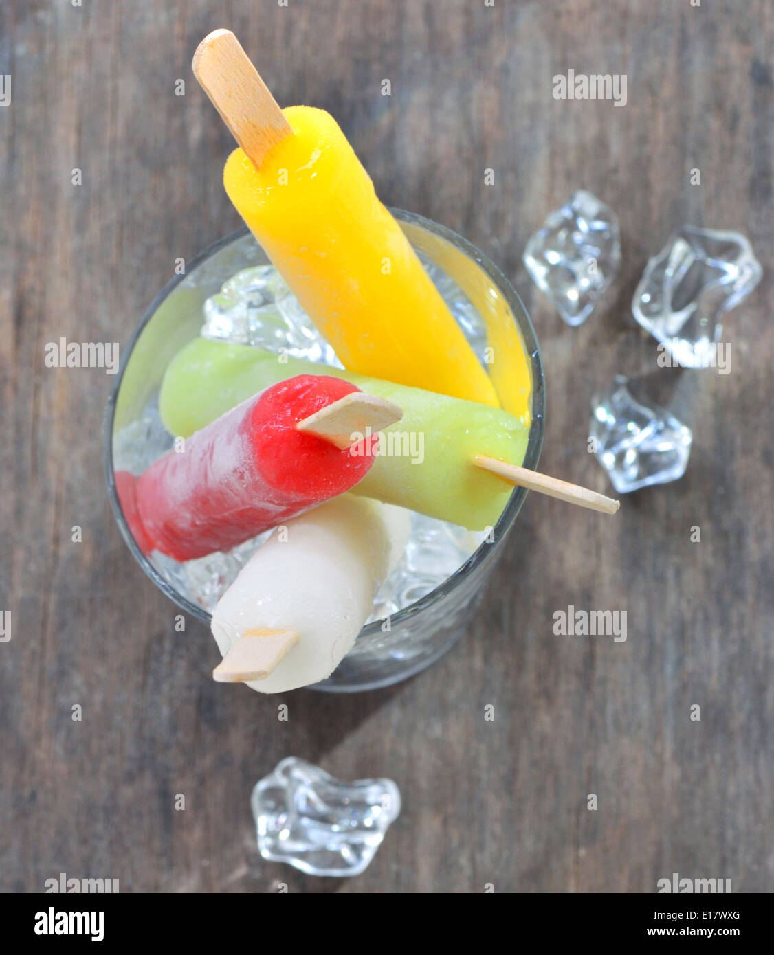 fruit ice pops on old wood background Stock Photo - Alamy
