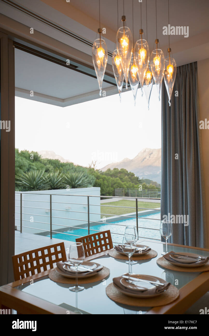 Dining room overlooking swimming pool hi-res stock photography and ...