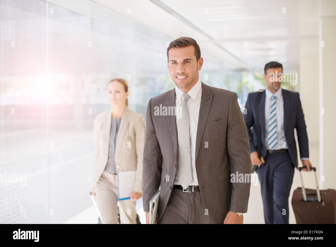 Three business walking hi-res stock photography and images - Alamy