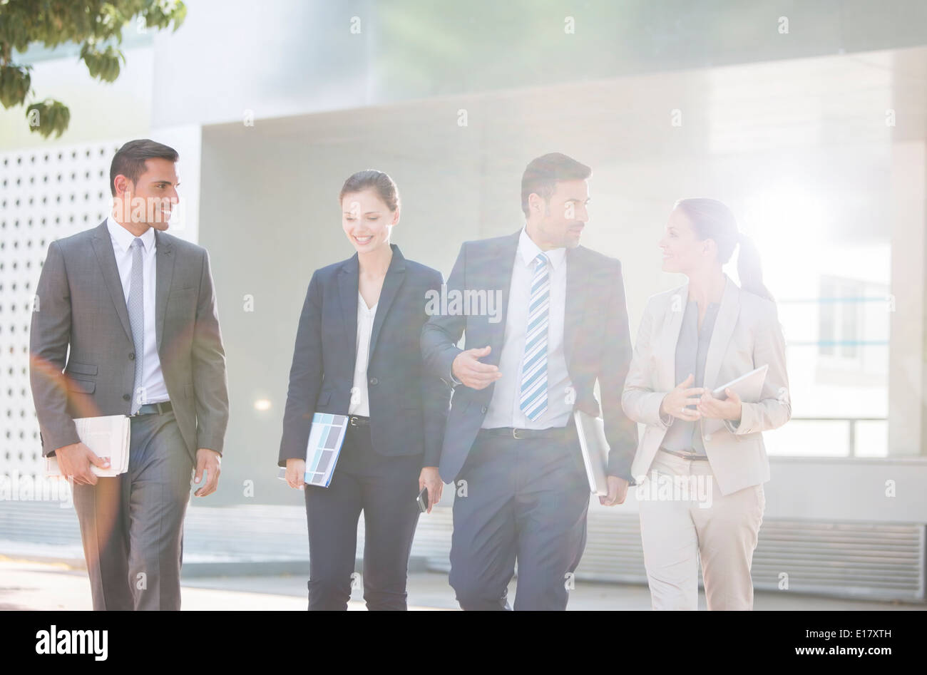 Business people talking outdoors Stock Photo - Alamy