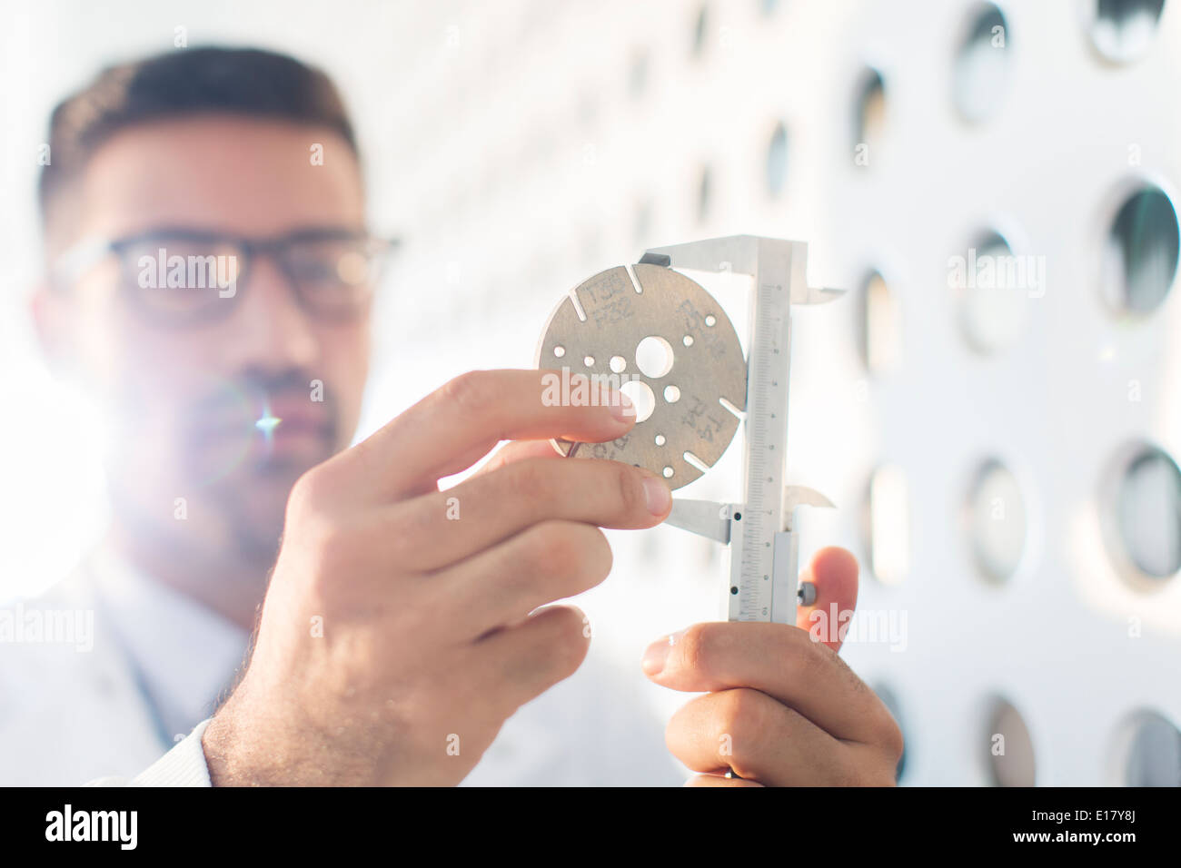 Scientist using calipers Stock Photo - Alamy