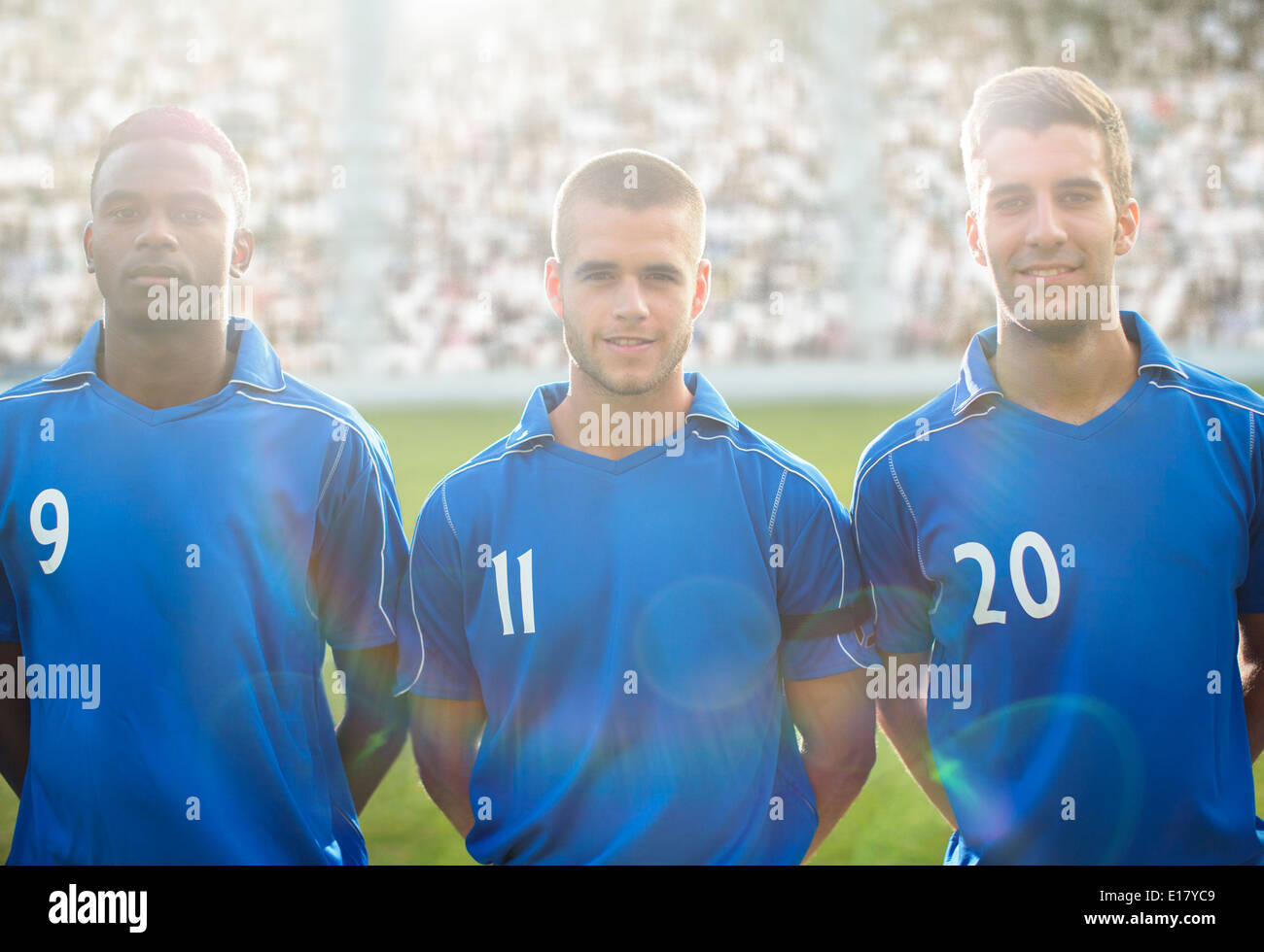 Soccer players smiling on field Stock Photo - Alamy