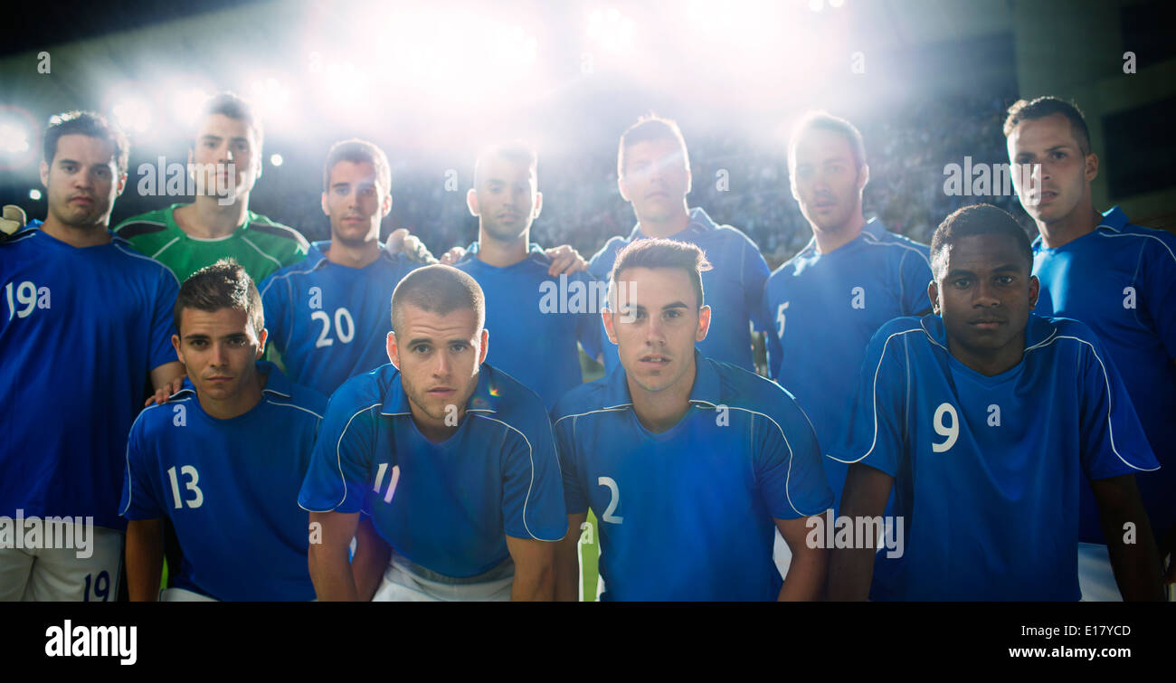 Soccer team standing in stadium Stock Photo - Alamy