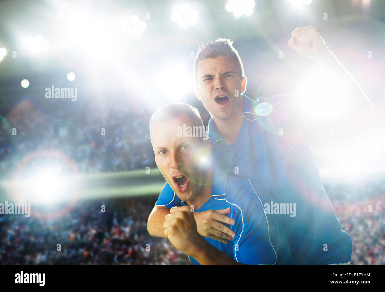 Soccer players celebrating on field Stock Photo - Alamy