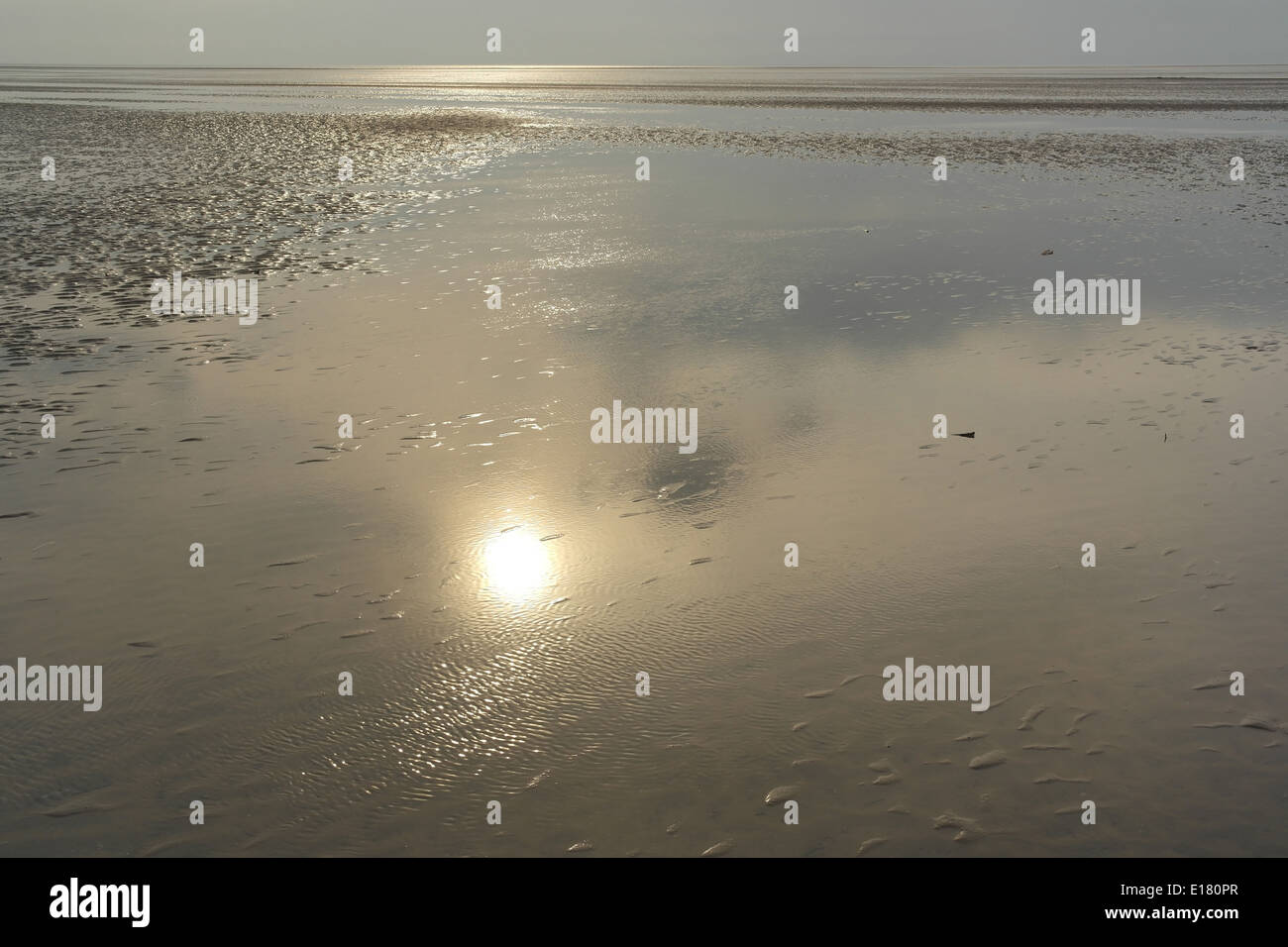 1 sun shining reflecting wet sand pool centre foreground hi-res stock ...