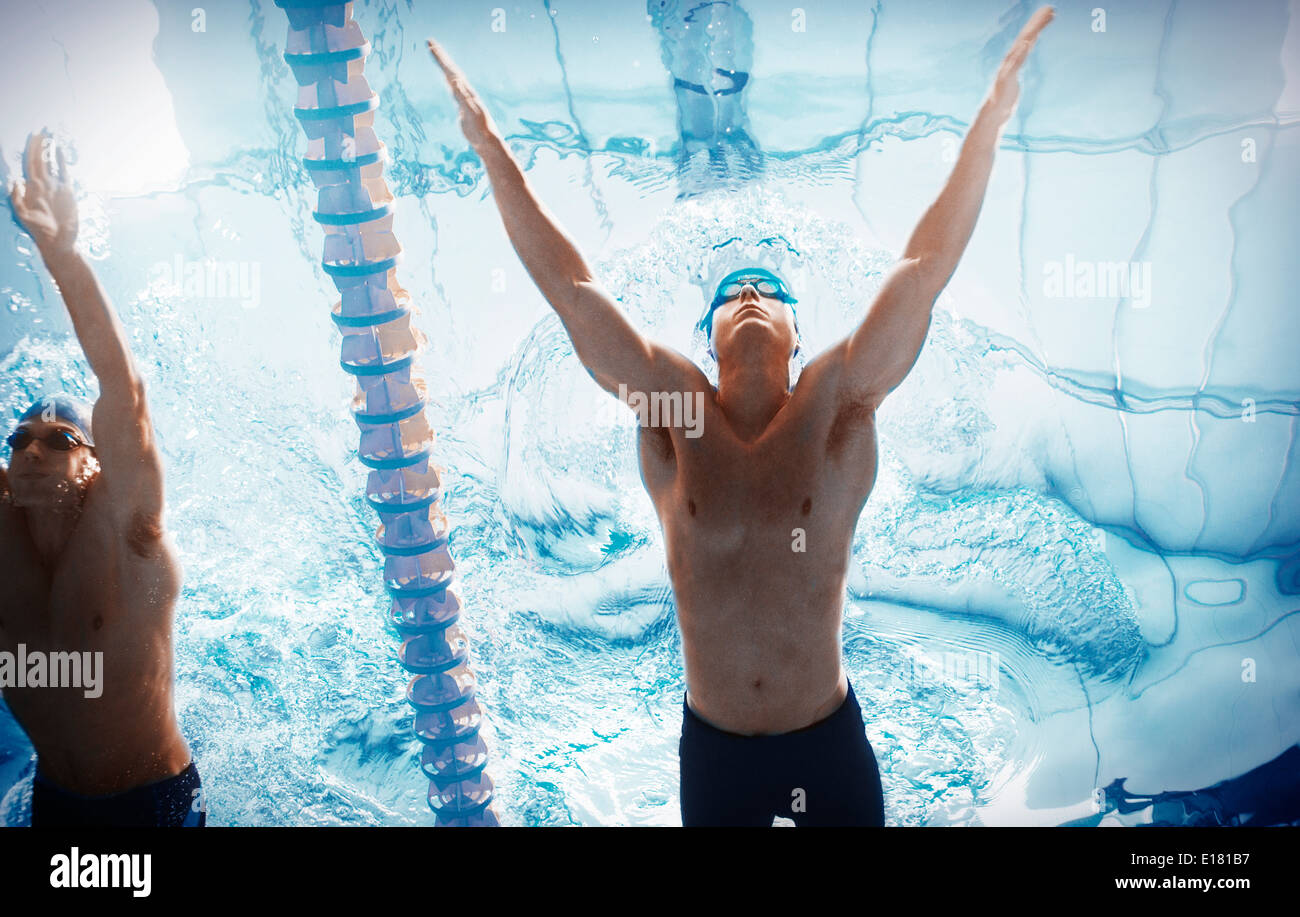 Swimmers racing in pool Stock Photo - Alamy