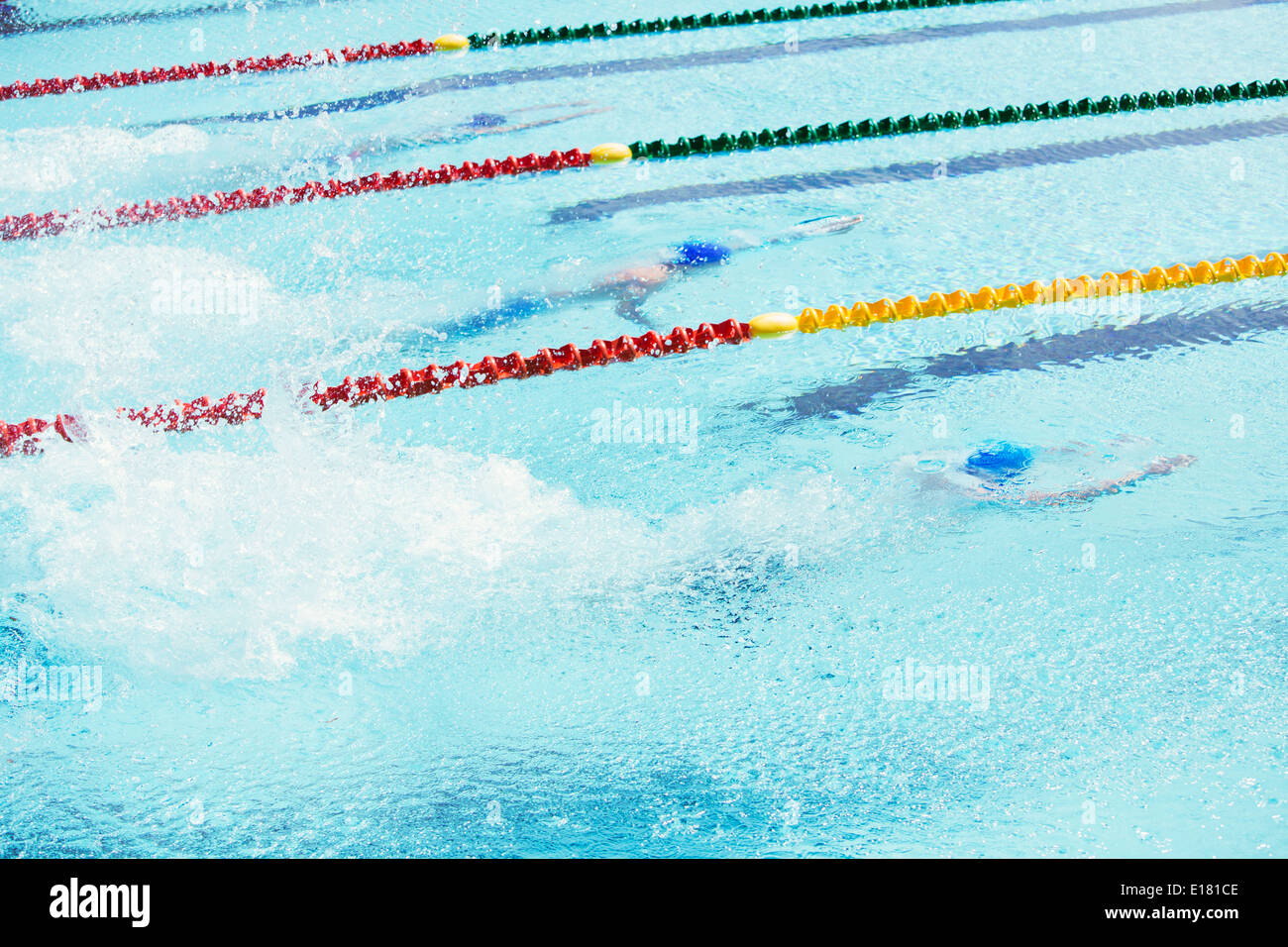 Swimmers racing in pool Stock Photo - Alamy