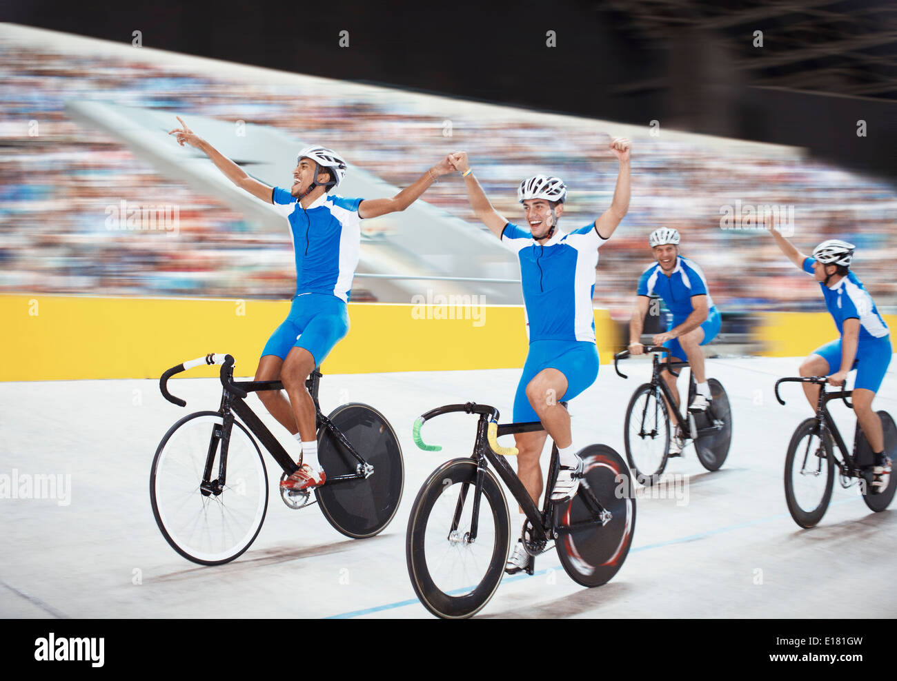 Track cycling team celebrating in velodrome Stock Photo - Alamy
