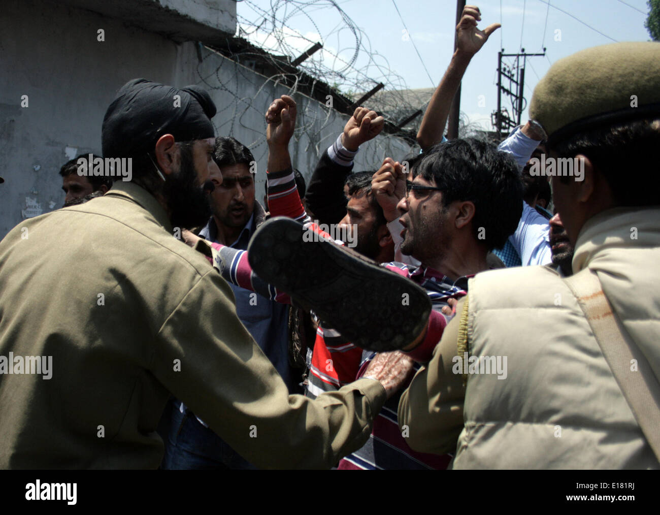 Srinagar, Kashmir. 26th May, 2014. State government employees carry an ...