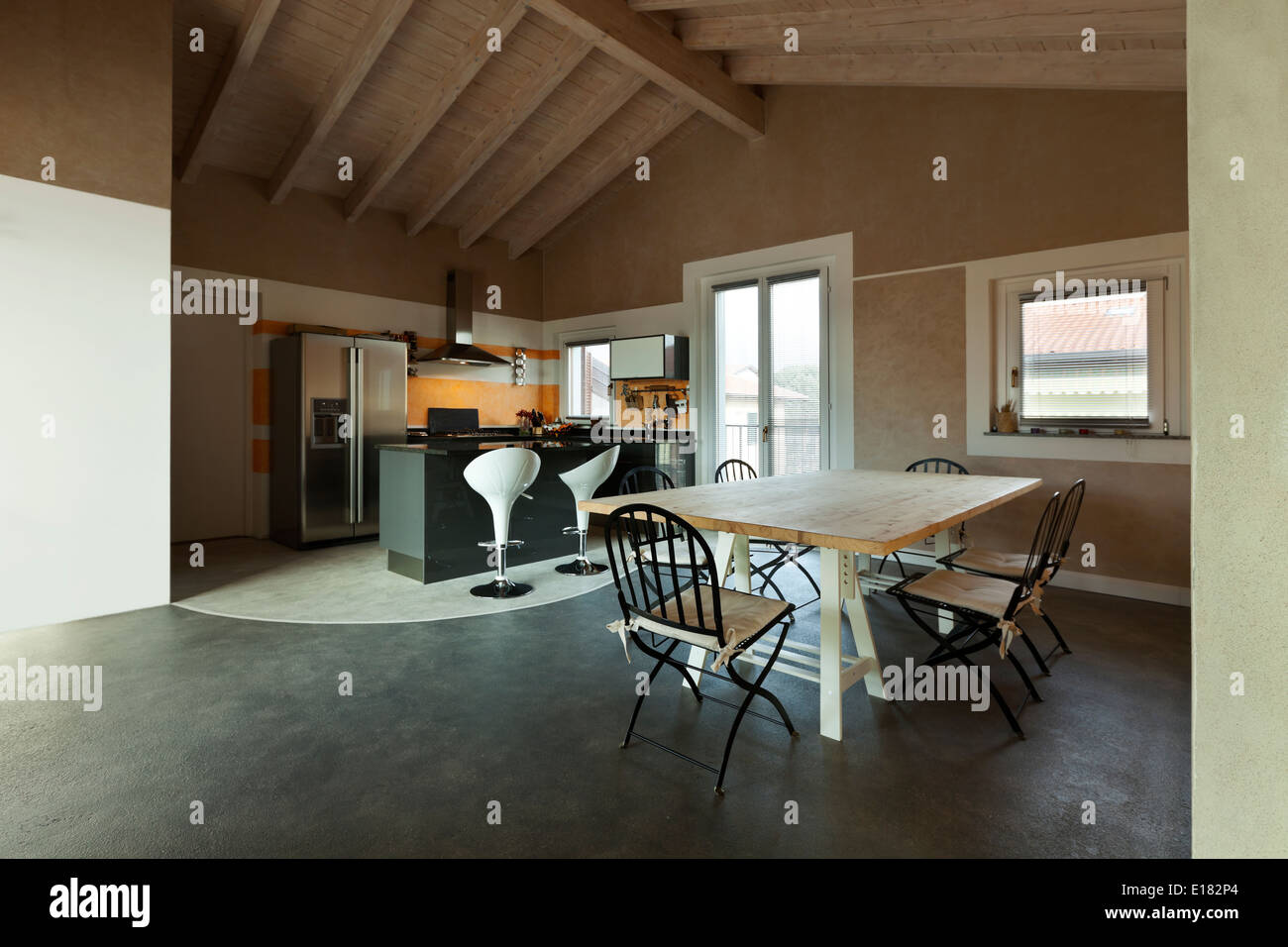 interior, new loft furnished, view of dining table and kitchen Stock ...