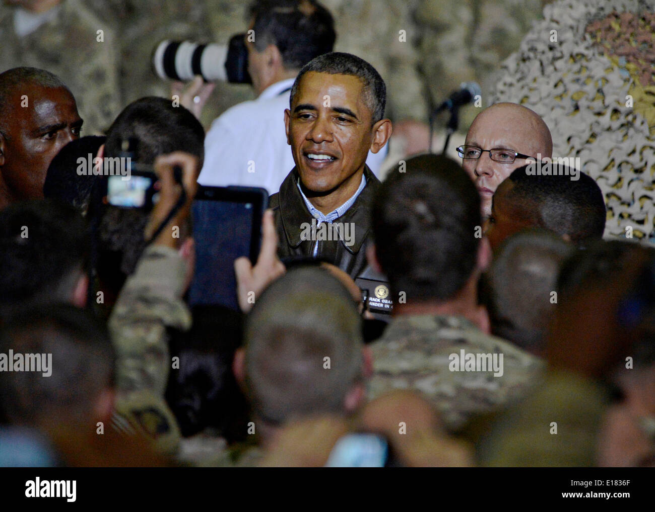 US President Barack Obama shakes hands with service members during an ...