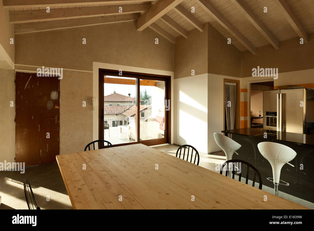 interior, new loft furnished, view of dining table and kitchen Stock ...