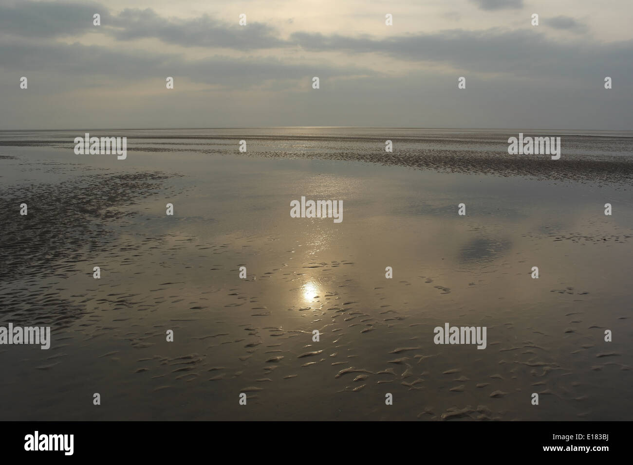 1 sun shining reflecting wet sand pool centre foreground hi-res stock ...