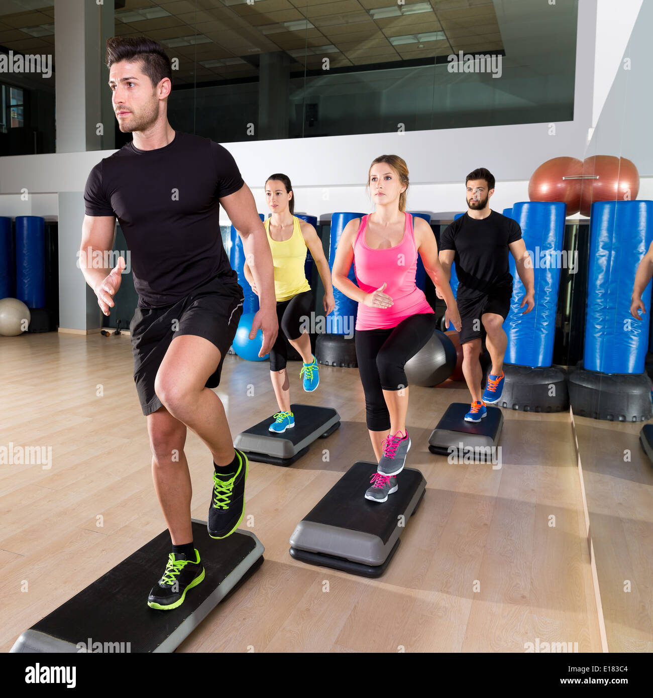Cardio step dance people group at fitness gym training workout Stock Photo - Alamy