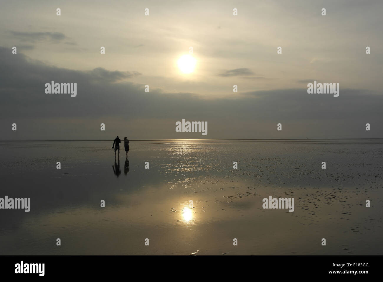 1 sun shining reflecting wet sand pool centre foreground hi-res stock ...