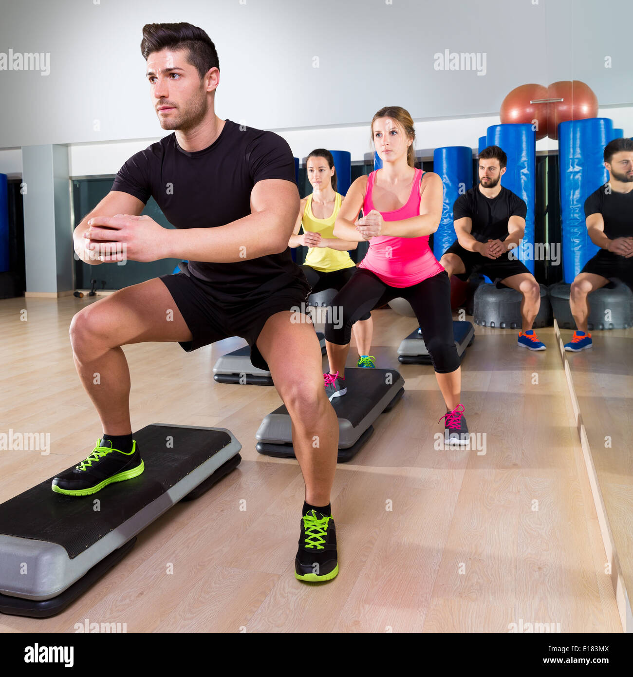 Cardio step dance squat people group at fitness gym training workout ...