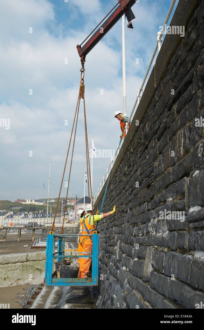 Repairing promenade wall after 2014 storms Aberystwyth Stock Photo - Alamy