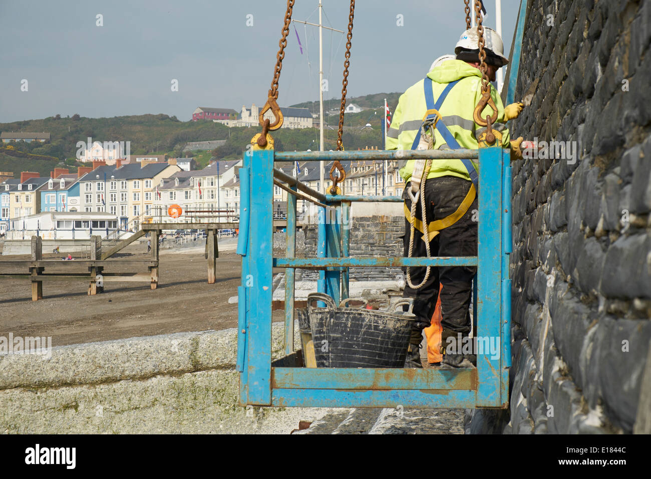 Repairing promenade wall after 2014 storms Aberystwyth Stock Photo - Alamy