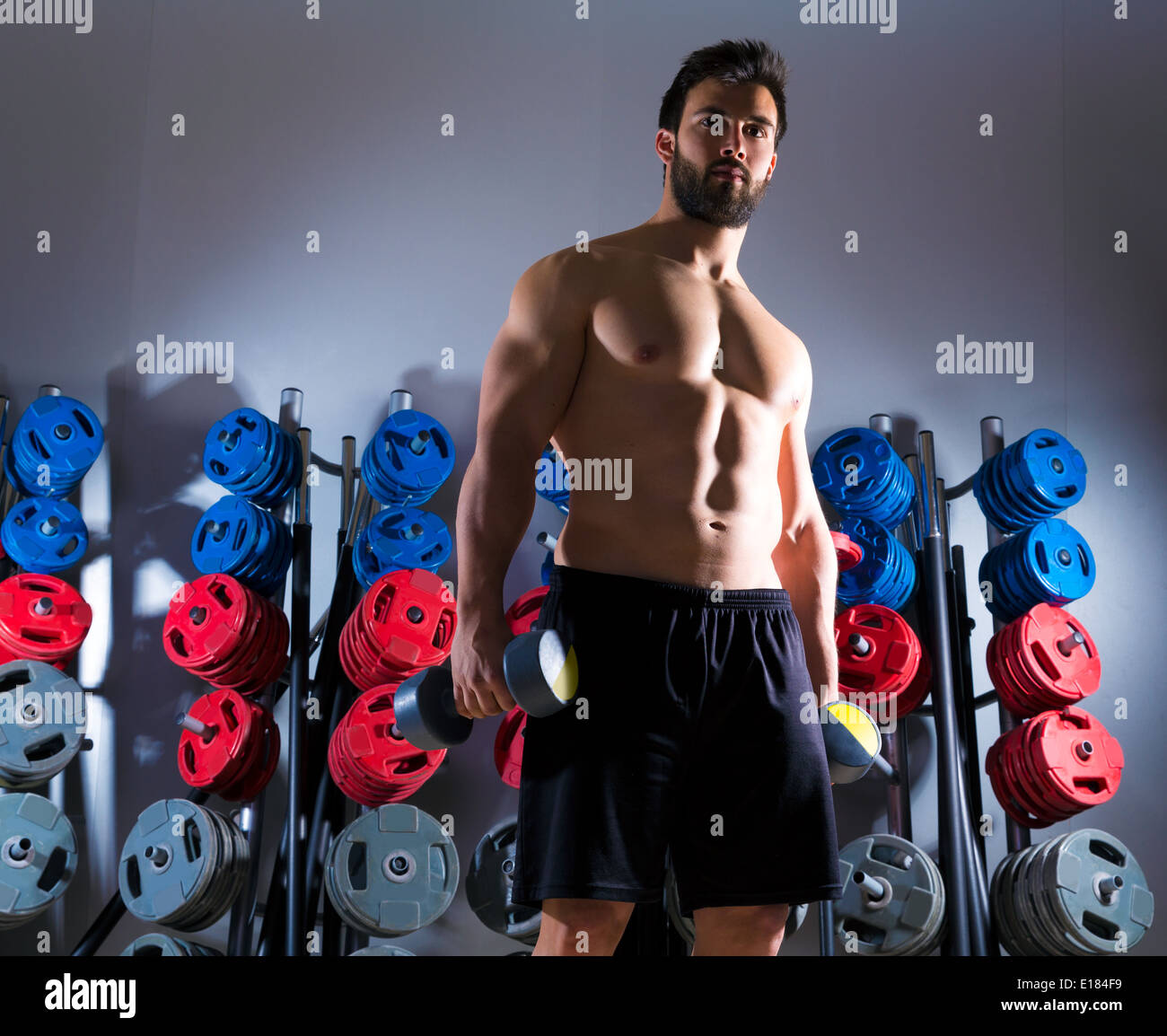 Dumbbell man workout fitness club at weightlifting gym Stock Photo - Alamy