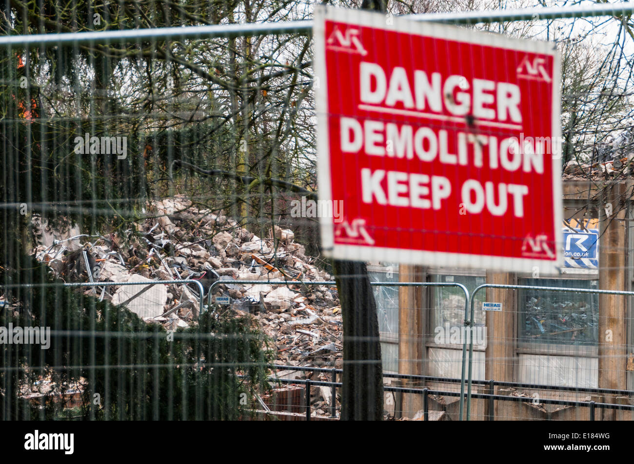 Danger demolition keep out sign mounted on the fencing surrounding the ...