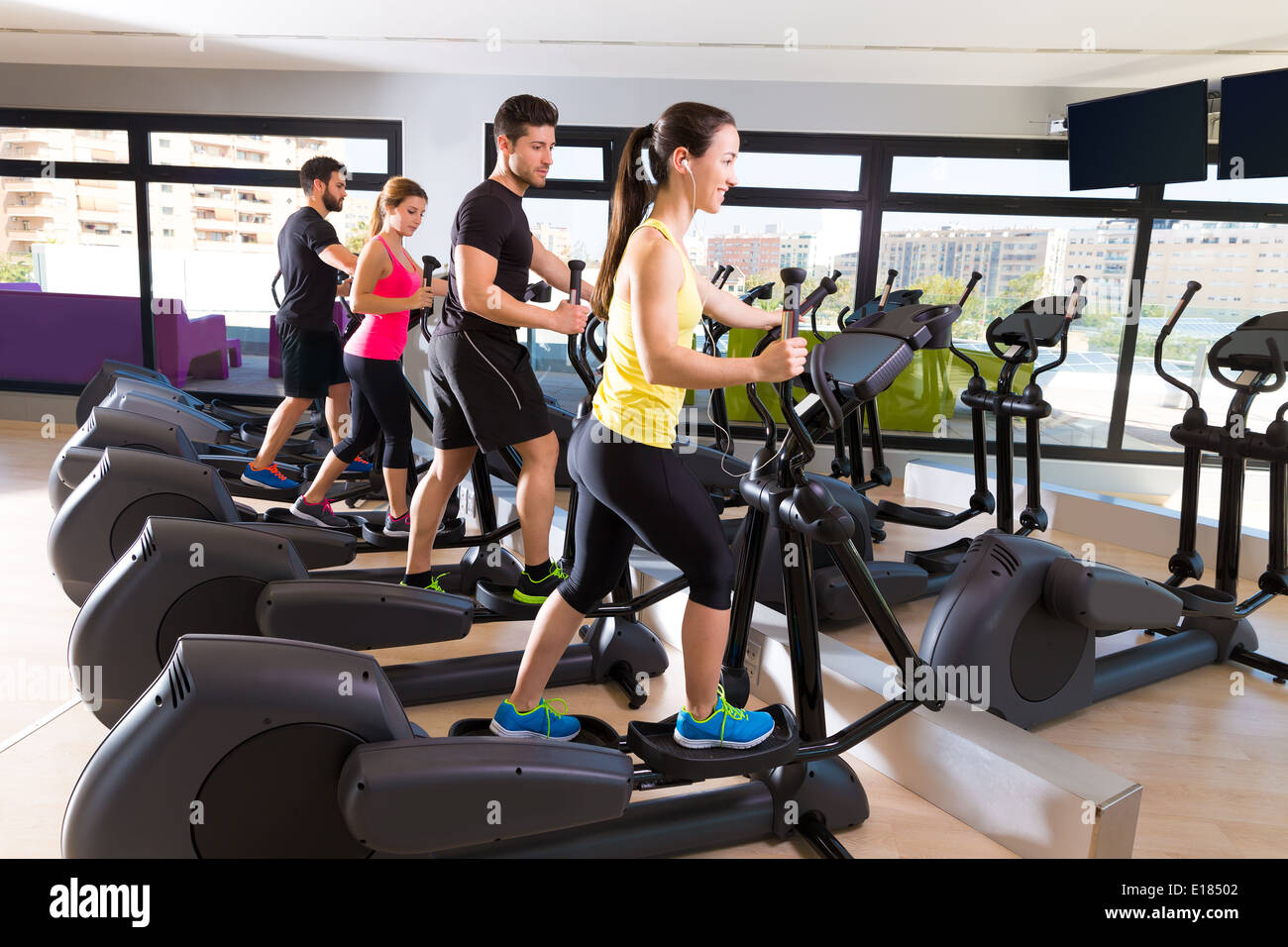 Aerobics elliptical walker trainer group at fitness gym workout Stock ...