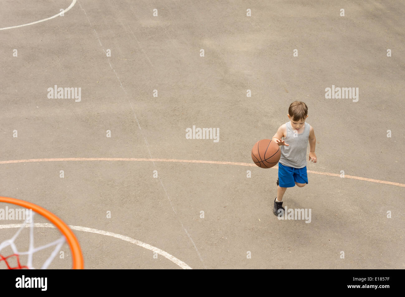 Boy bouncing ball hi-res stock photography and images - Alamy