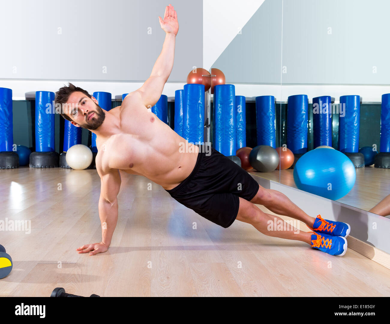 Fitness side push ups man pushup at gym workout execises Stock Photo ...