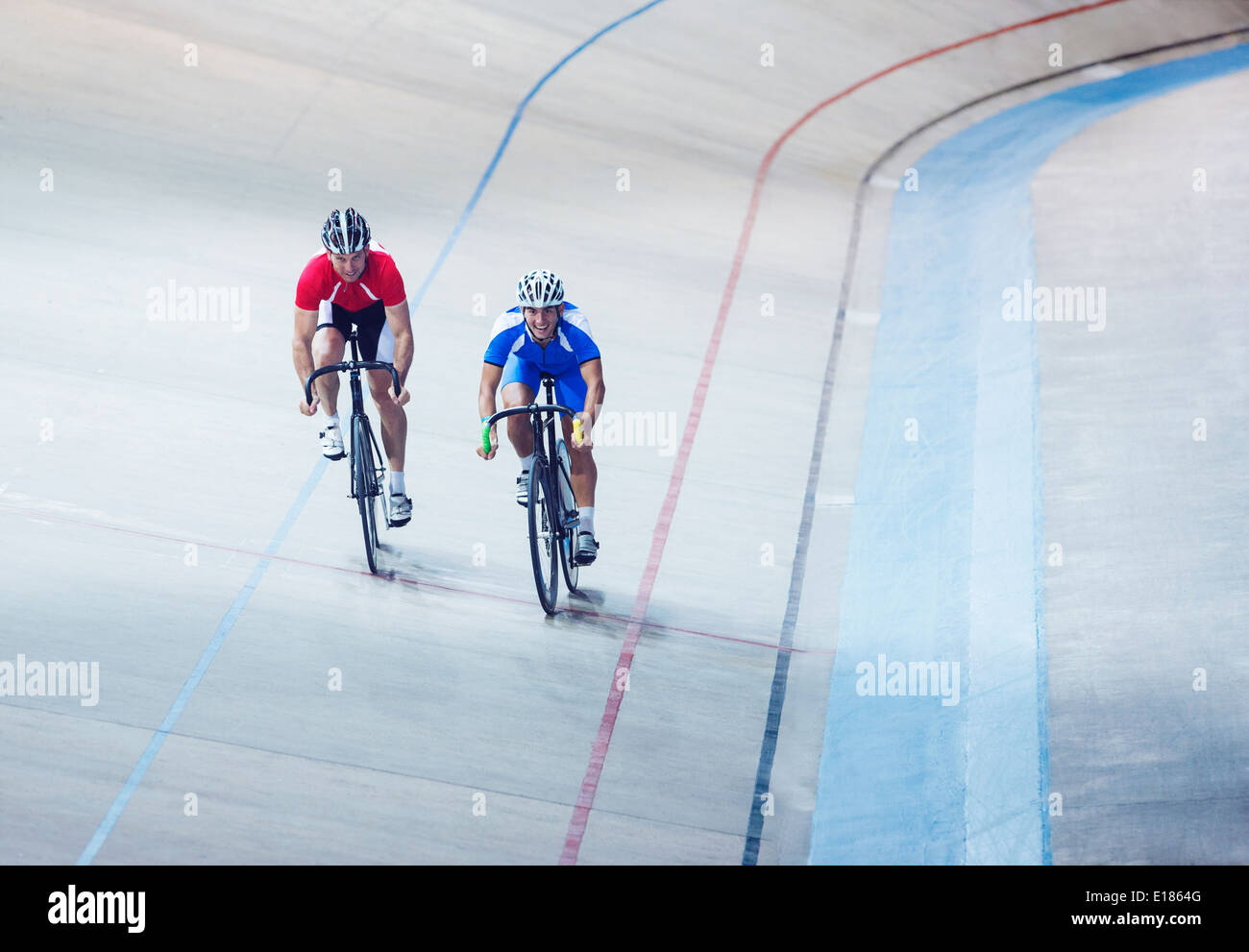 Track cyclists riding in velodrome Stock Photo - Alamy